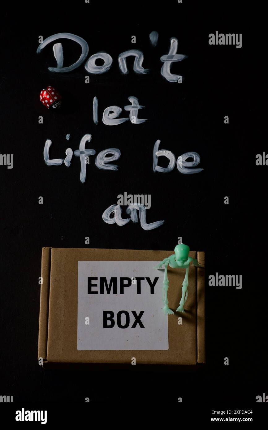 Don't let life be an empty box - handwritten in white letters on black ...