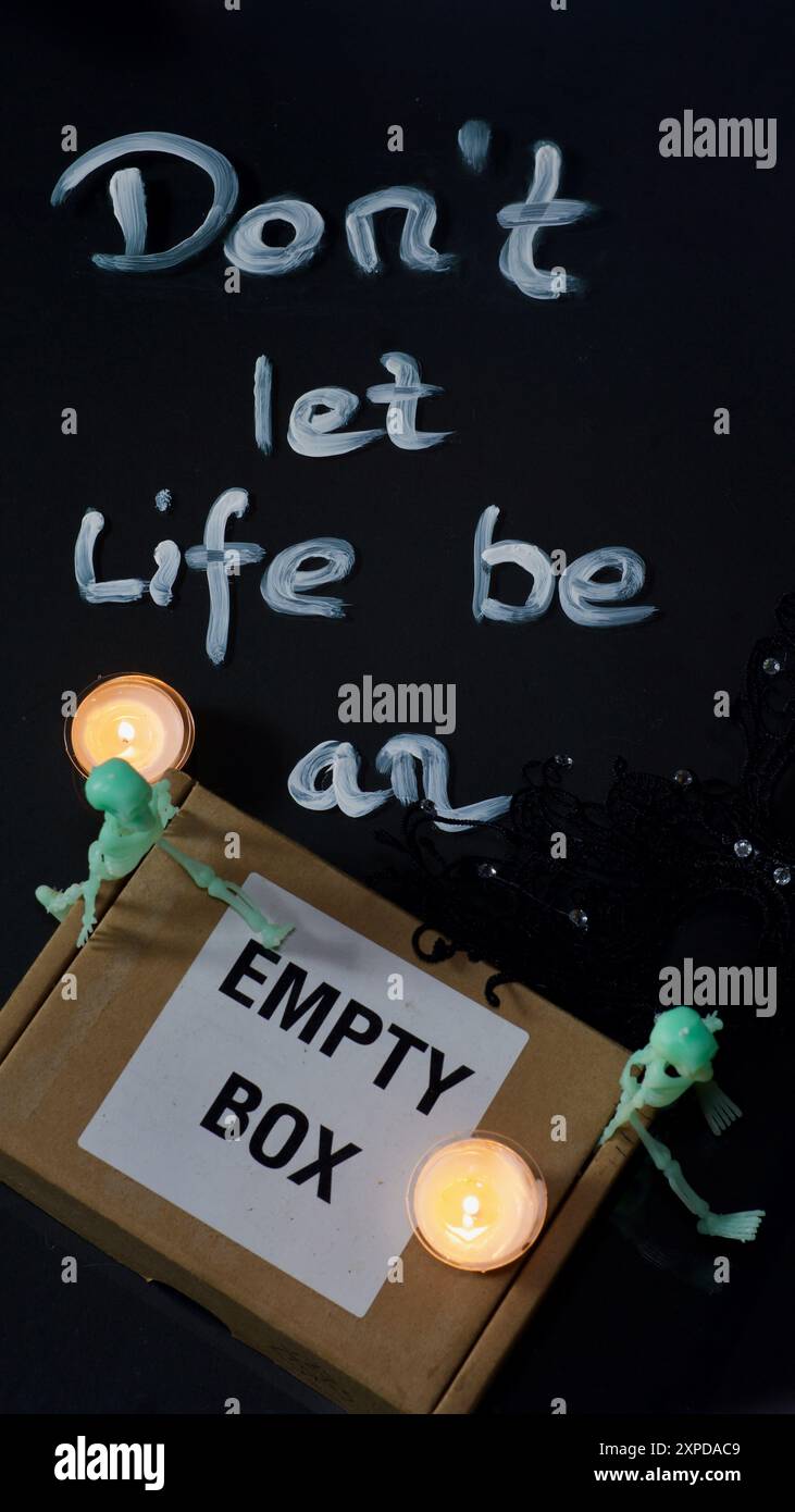 Don't let life be an empty box - handwritten in white letters on black ...