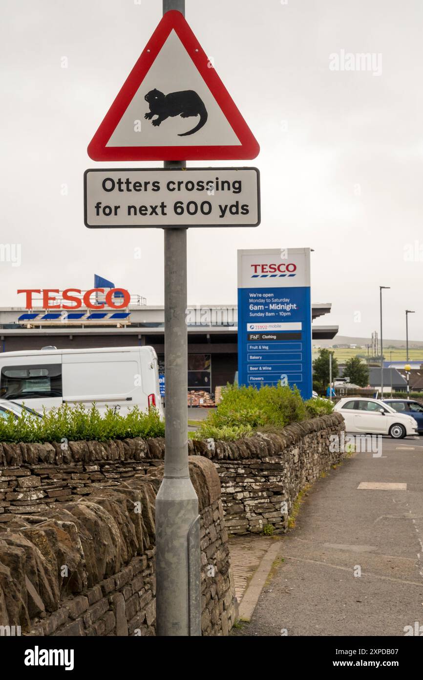 An otters crossing roadsign outside a Tesco supermarket in Kirkwall ...