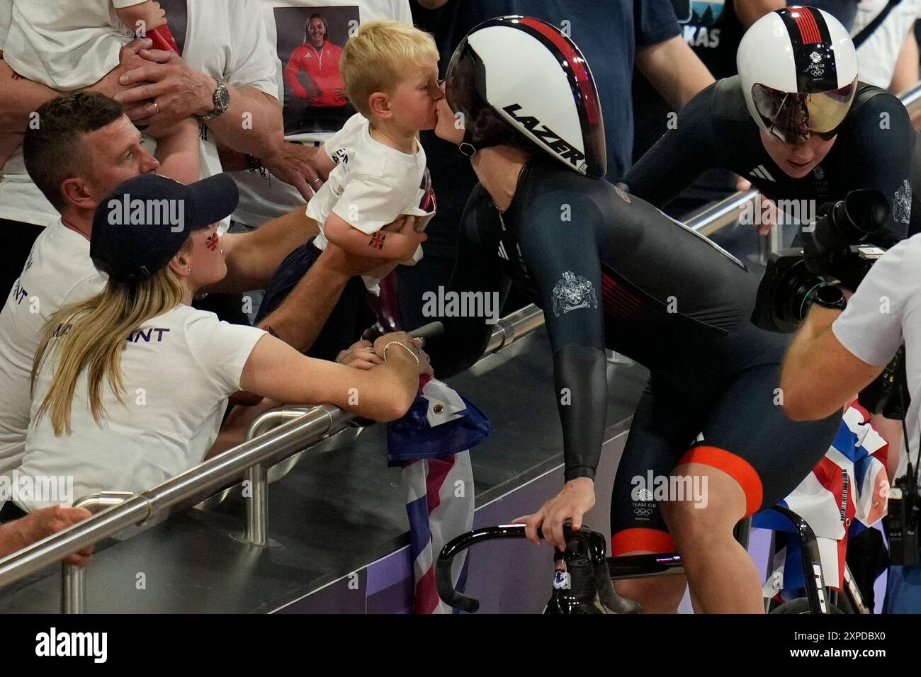 Katy Marchant of Team Britain kisses a child as she celebrates winning ...