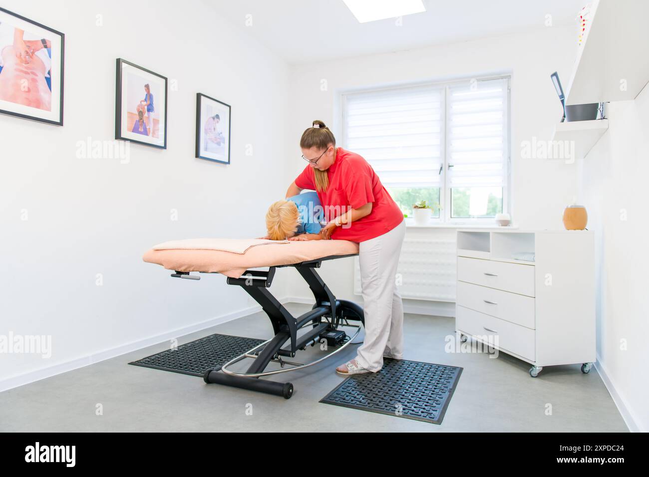 Young preschooler boy in a physical therapy session with a female ...