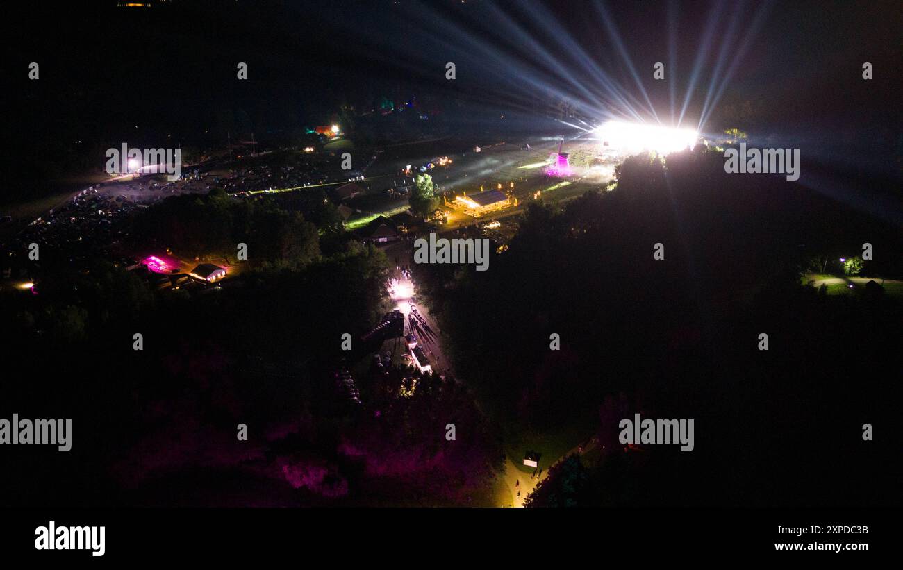 Drone photography of a music festival ar night and concert at stage ...