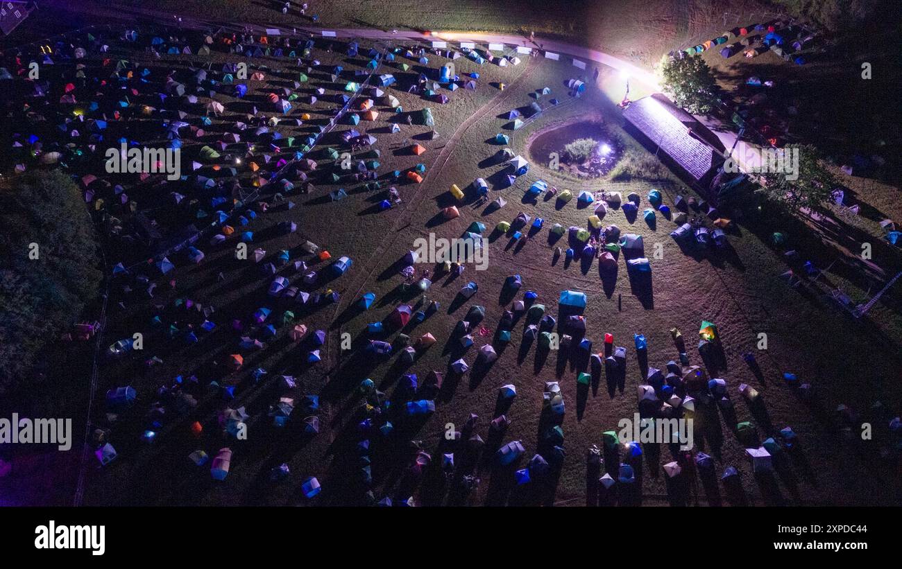 Drone photography of tent camp at music festival during dark night ...