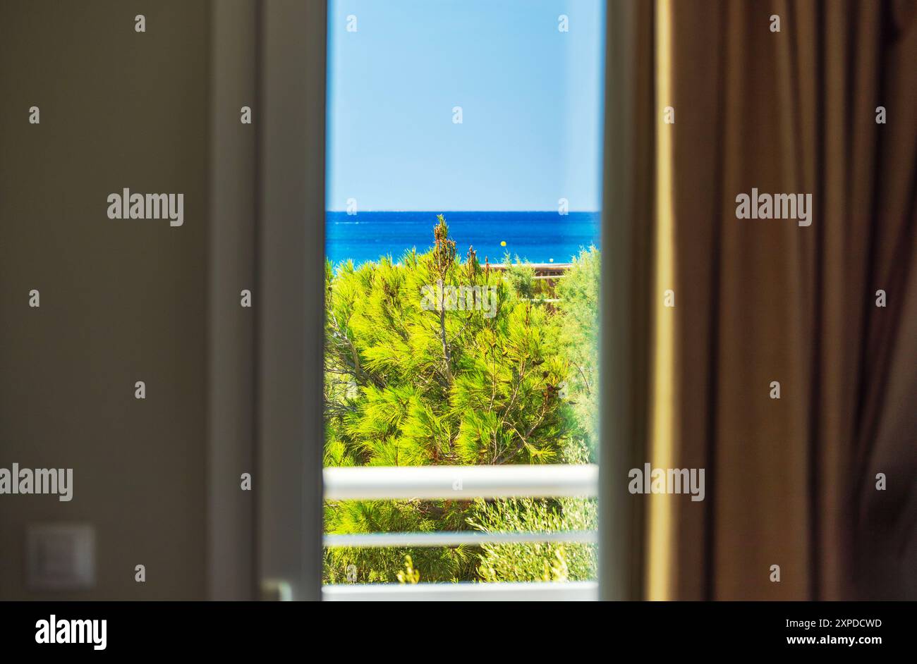 Beautiful view from hotel room window of lush tropical vegetation along ...