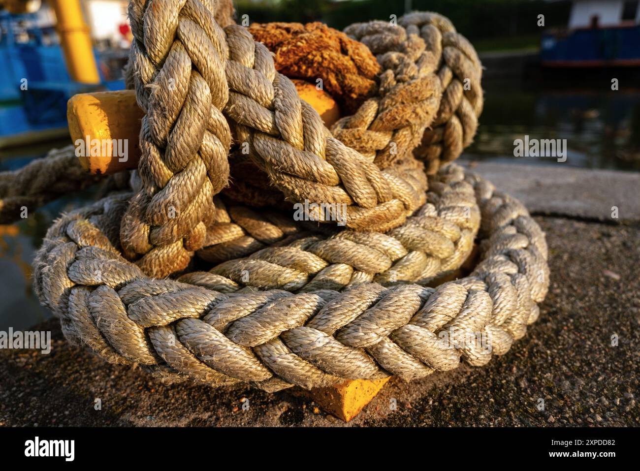 thick rope used for mooring at marina Stock Photo - Alamy