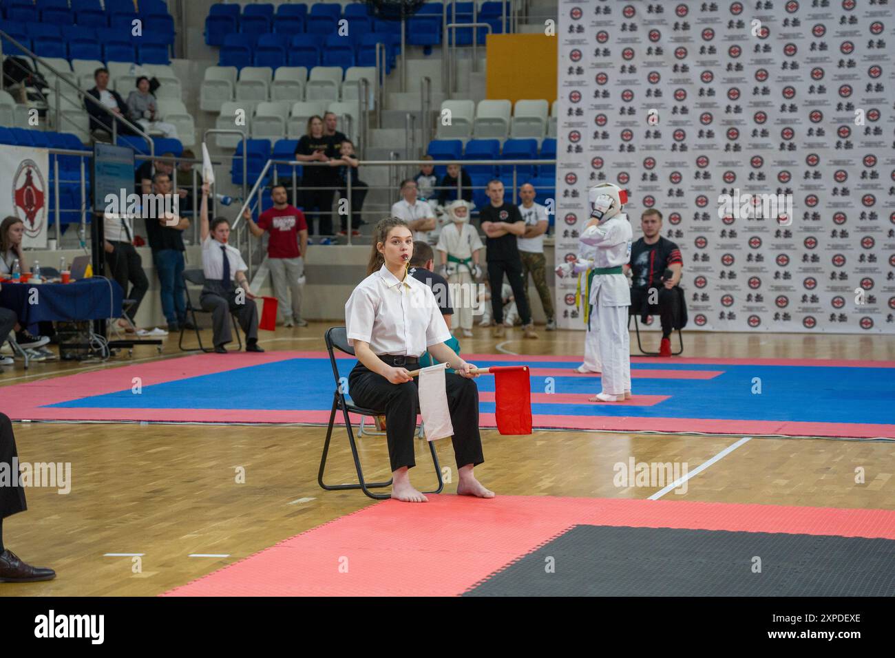 Minsk, Belarus - April 06, 2024: The female karate referee sitting ...