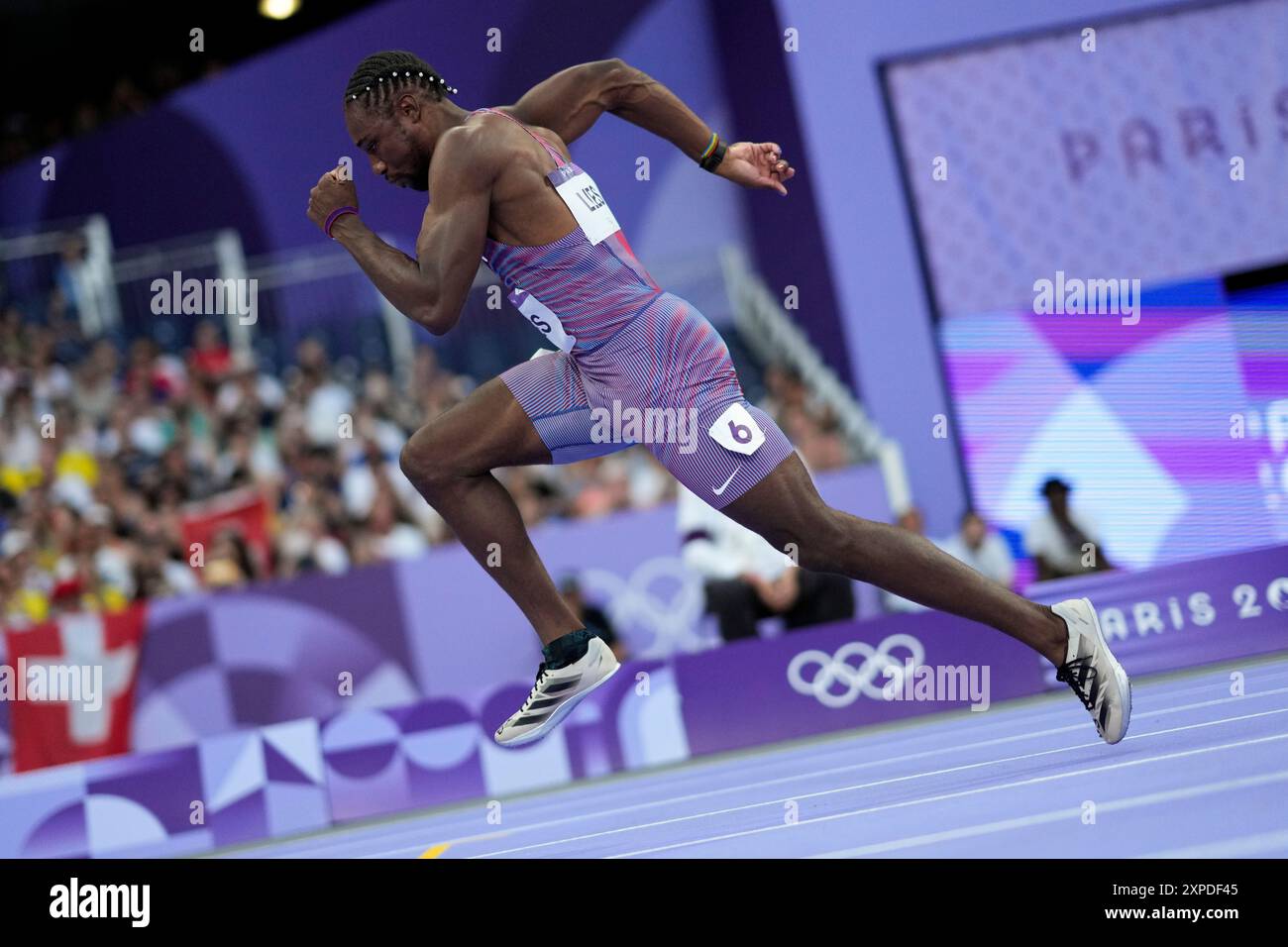 Noah Lyles, of the United States, competes during a heat in the men's ...