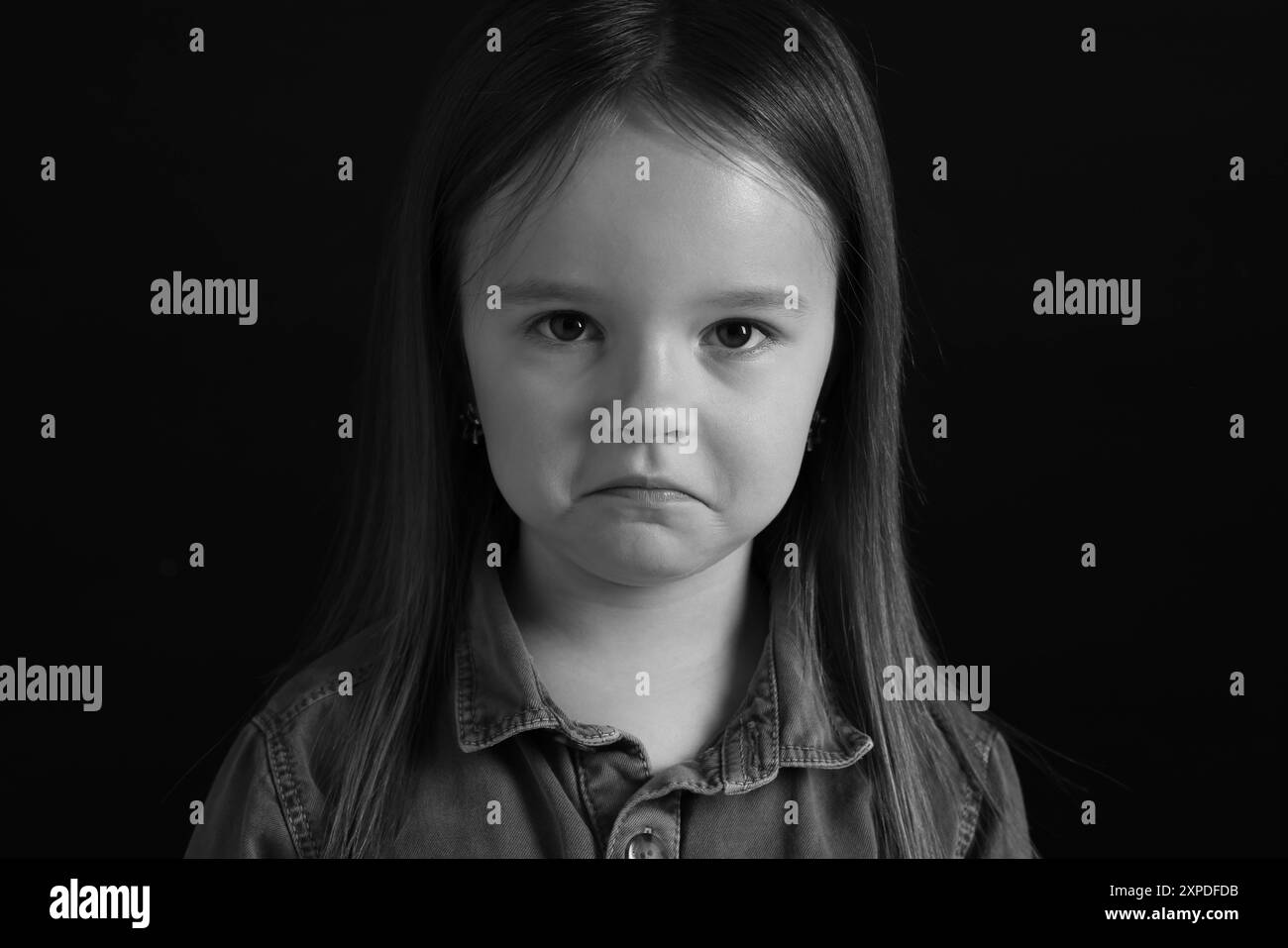 Portrait of sad girl on dark background, closeup. Black and white ...