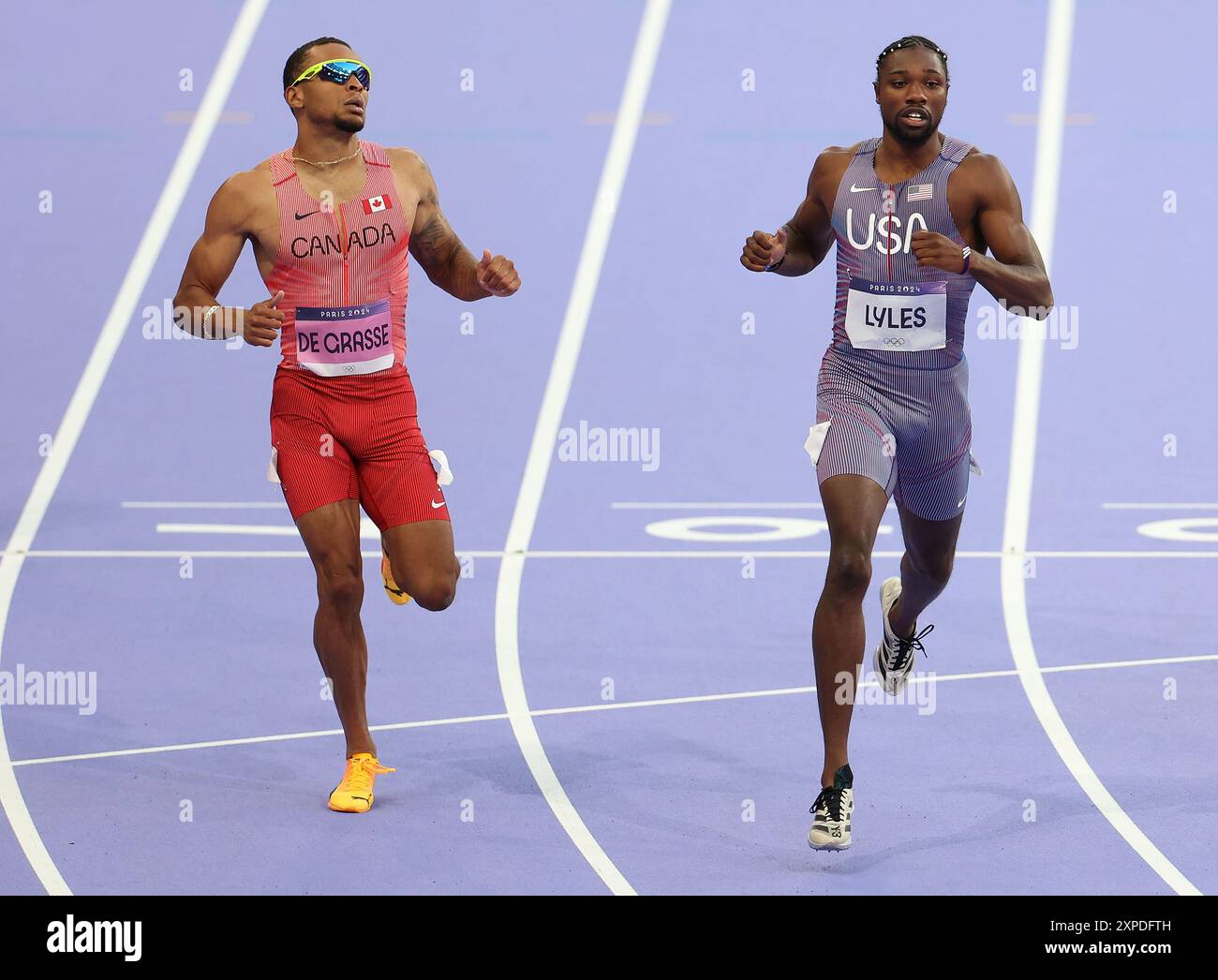 Paris, France. 5th Aug, 2024. Noah Lyles (R) of the United States and ...