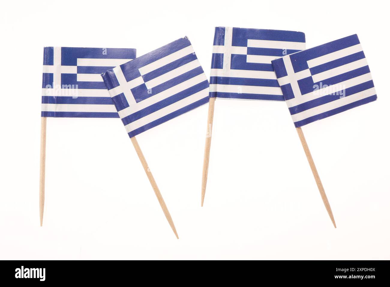 Small paper flags of Greece isolated on white Stock Photo - Alamy