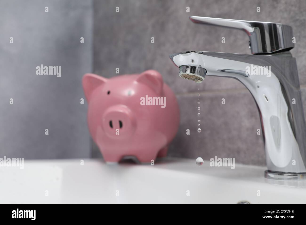 Water saving concept. Piggy bank and water drops flowing from tap in ...