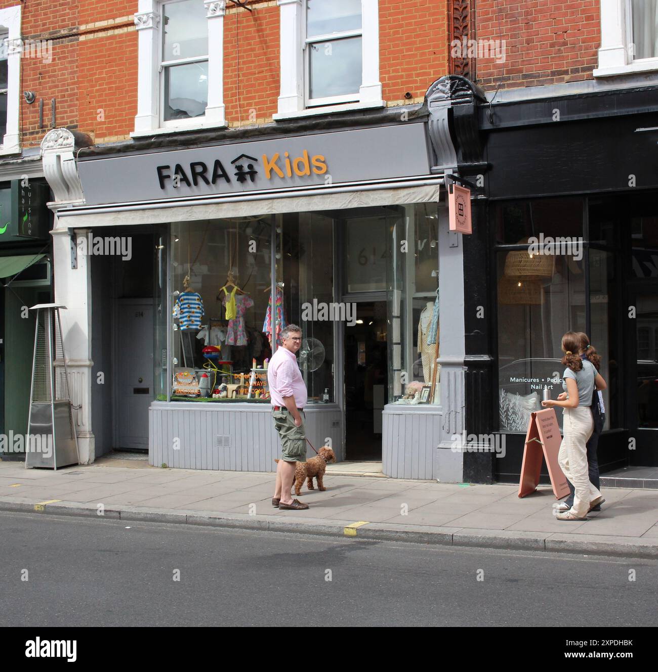 Frontage of Fara Kids charity shop in West London Stock Photo - Alamy
