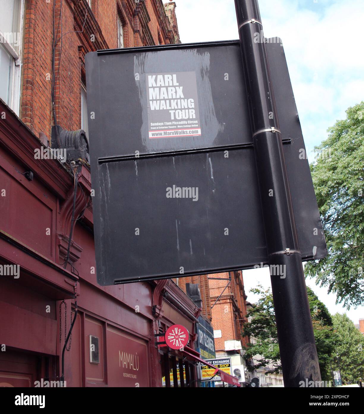 Flyer advertising the Karl Marx walking tour on traffic sign in West ...