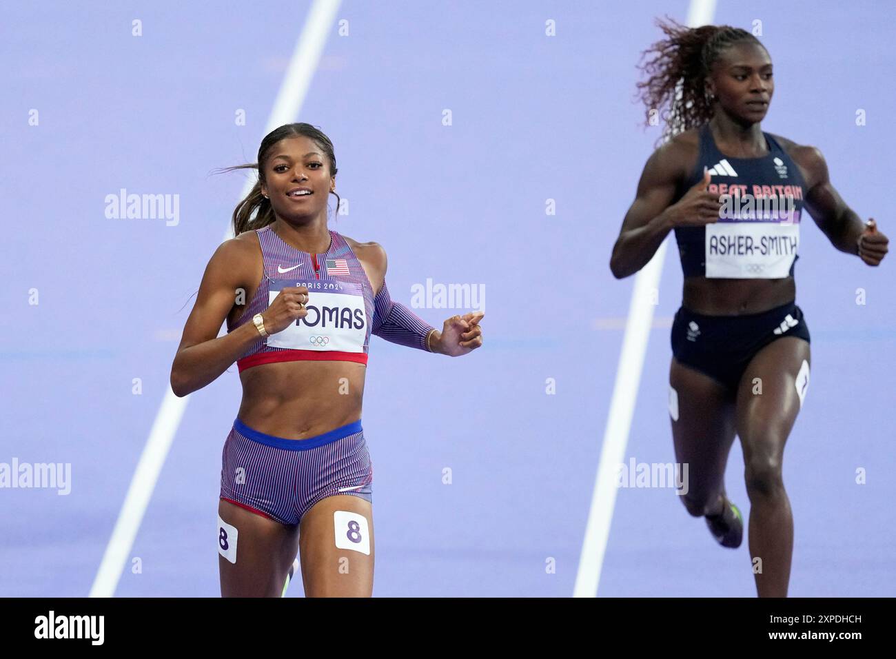 Gabrielle Thomas, of the United States, crosses the finish line ahead ...