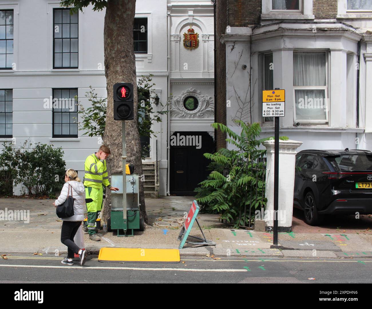 Temporary road crossing traffic light during roadworks in West London ...