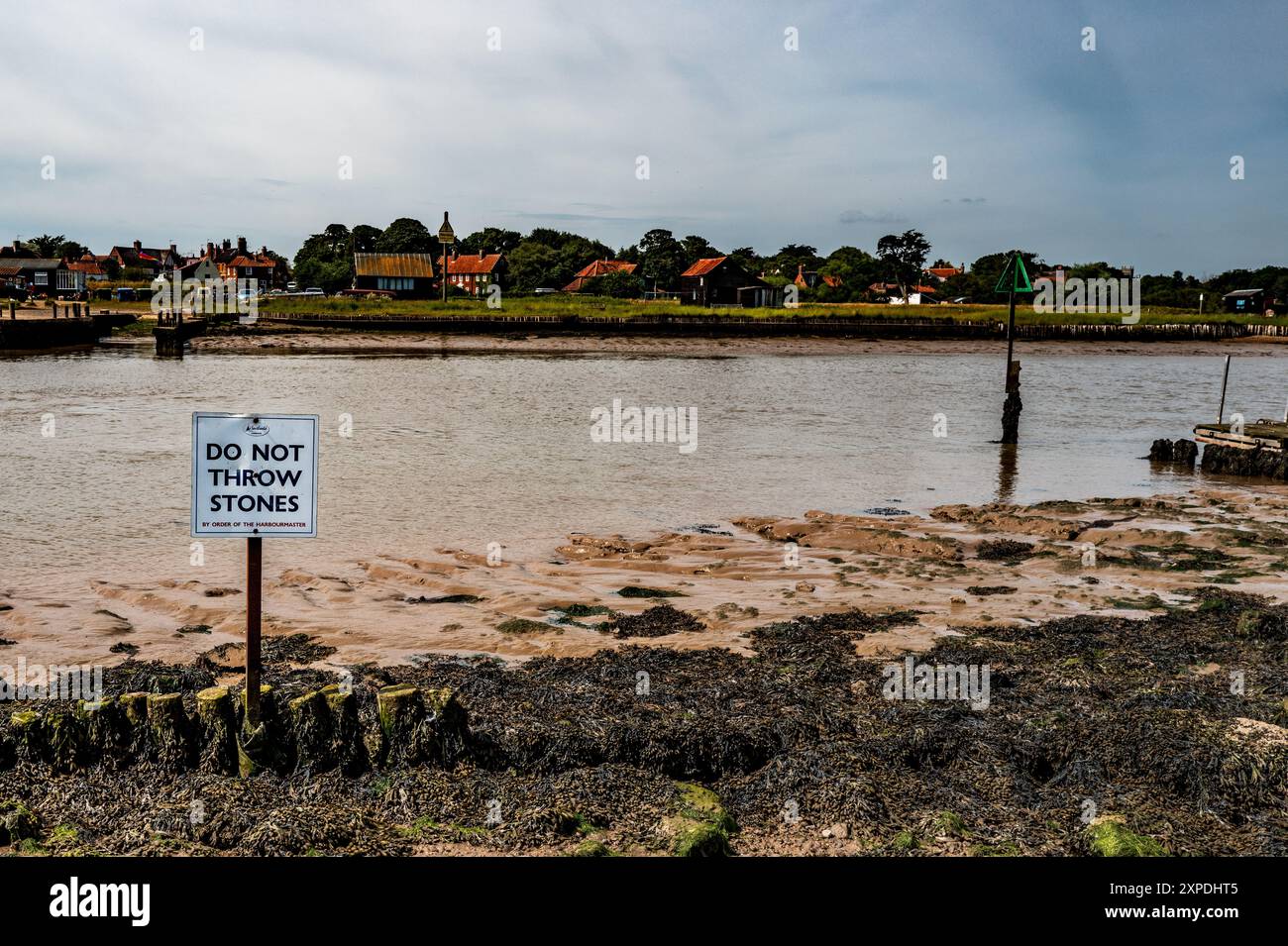 'Do not throw stones' sign in the mud at Southwold Harbour showing the ...