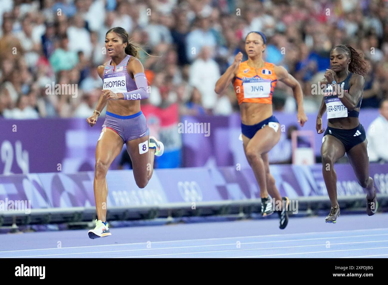 Gabrielle Thomas, of the United States, crosses the finish line ahead ...