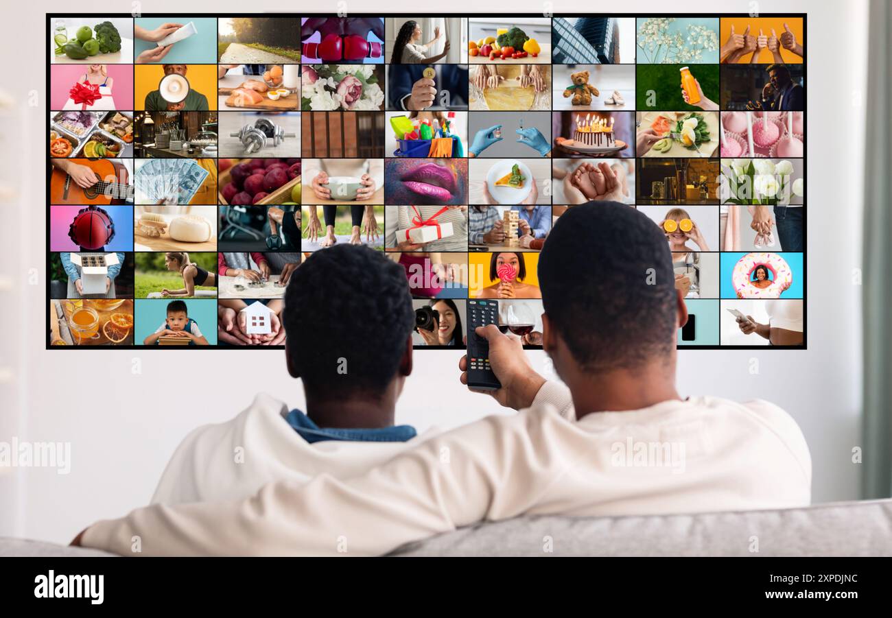 Two Men Watching Television With Multiple Images Displayed on Screen ...