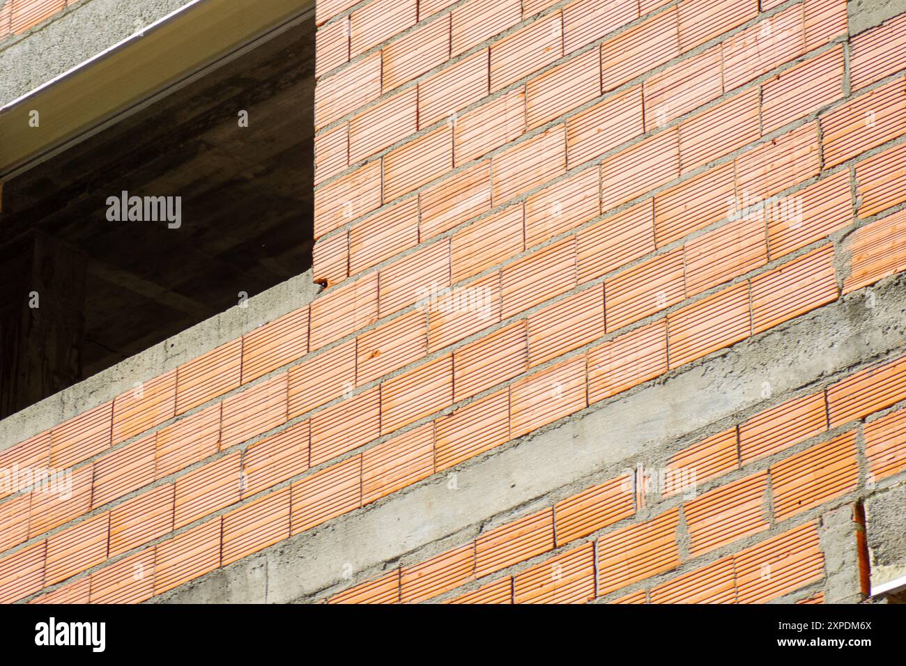 partial view of the facade of a brick and cement building under ...