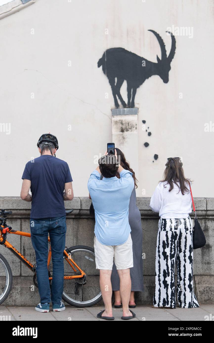 London, UK. 05 Aug 2024. People take photos of Street Artist Banksy's ...