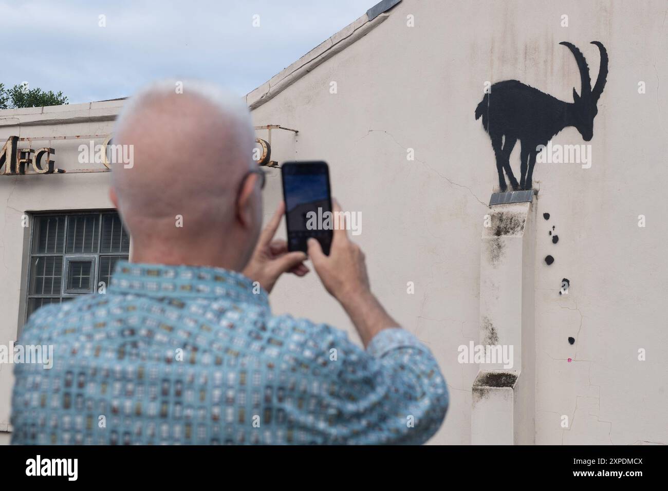 London, UK. 05 Aug 2024. People take photos of Street Artist Banksy's ...