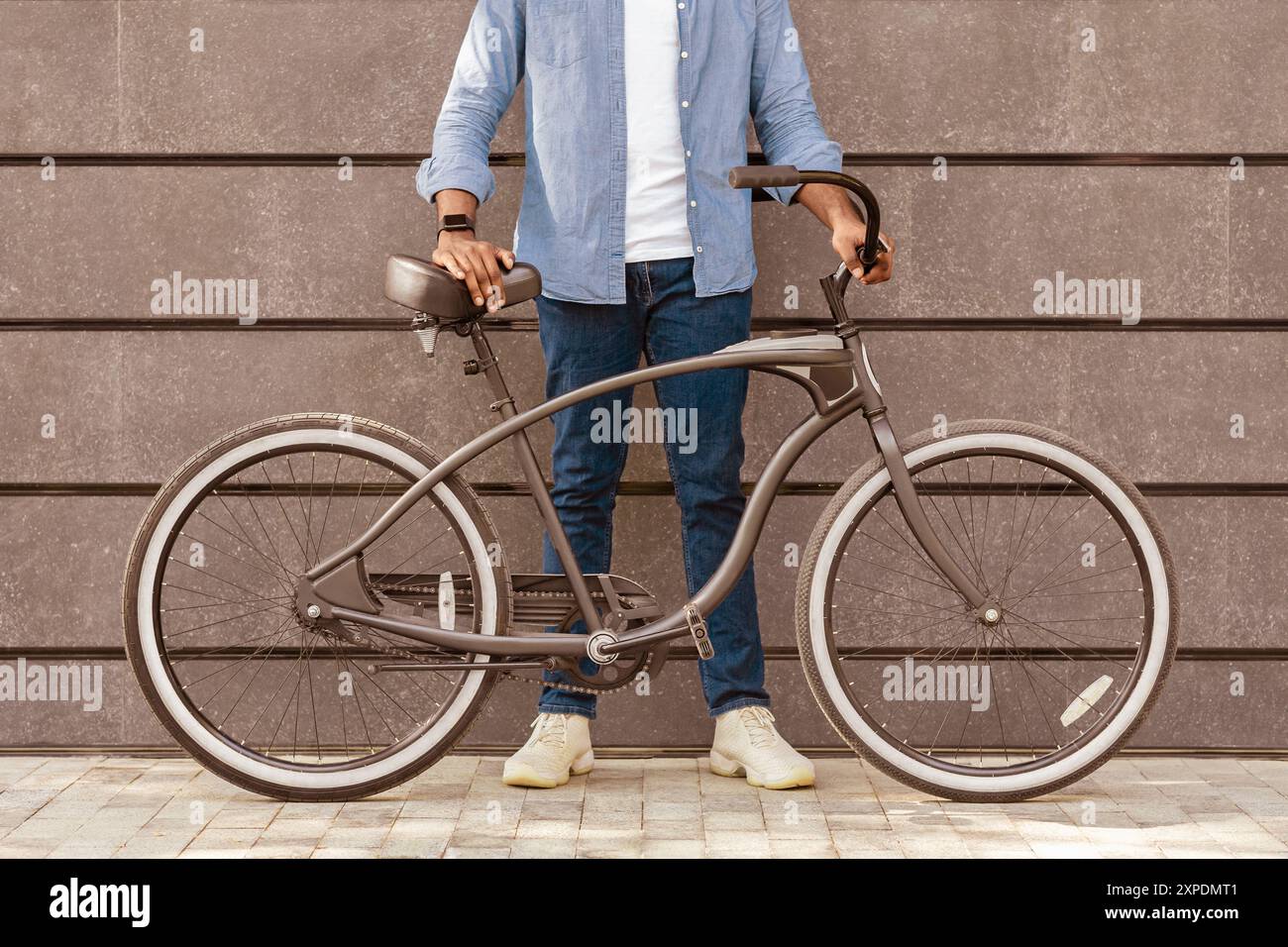 Unrecognizable Man Standing With Stylish Bicycle Over Grey Urban Wall ...