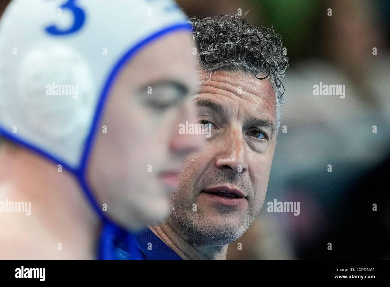 Romania's head coach Bogdan Rath watches Matei Lutescu during a men's ...