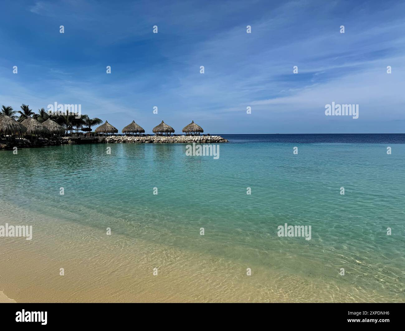 Sun protection house with palm leaves as a roof in Curacao by the sea ...