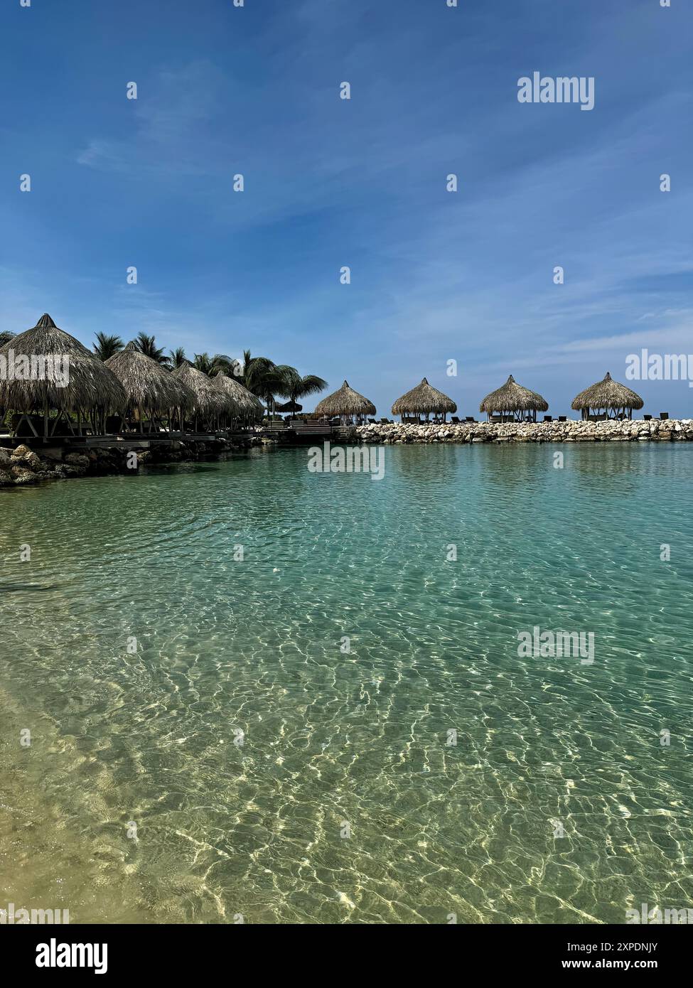 Sun protection house with palm leaves as a roof in Curacao by the sea ...