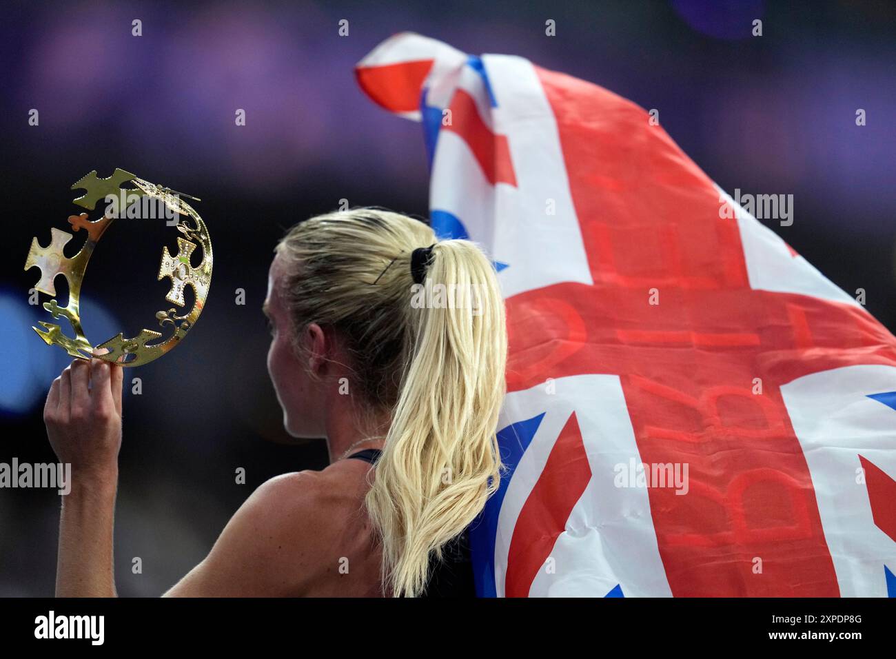 Keely Hodgkinson, of Britain, holds a crown while celebrating after winning the gold medal in ...