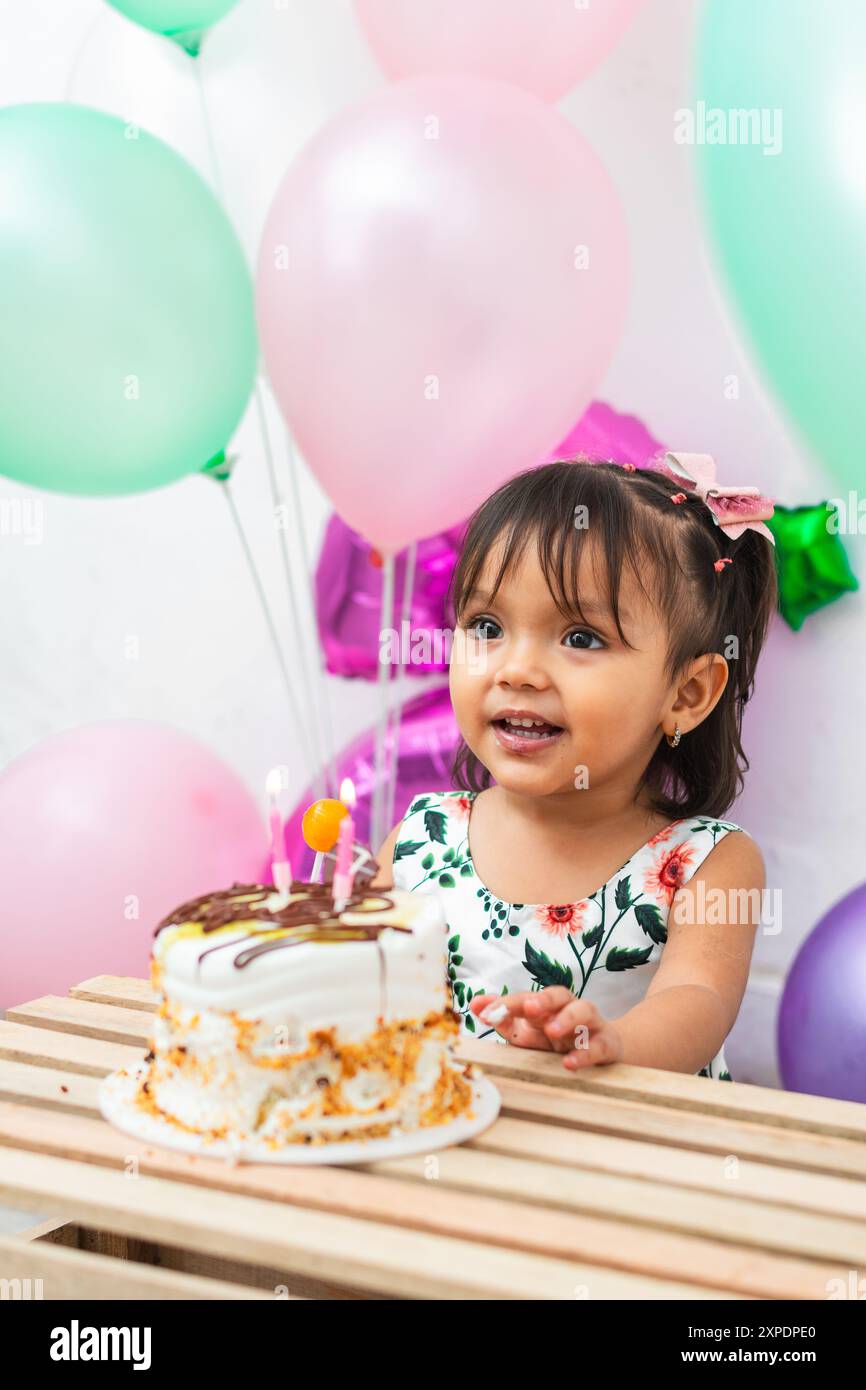little latin brunette girl very happy and smiling in front of her ...