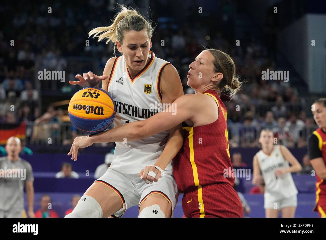 Germany's Sonja Greinacher (14) backs down Spain's Sandra Ygueravide ...