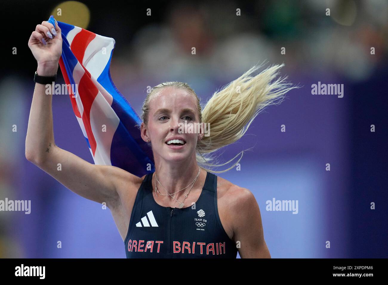 Keely Hodgkinson, of Britain, holds a crown while celebrating after ...