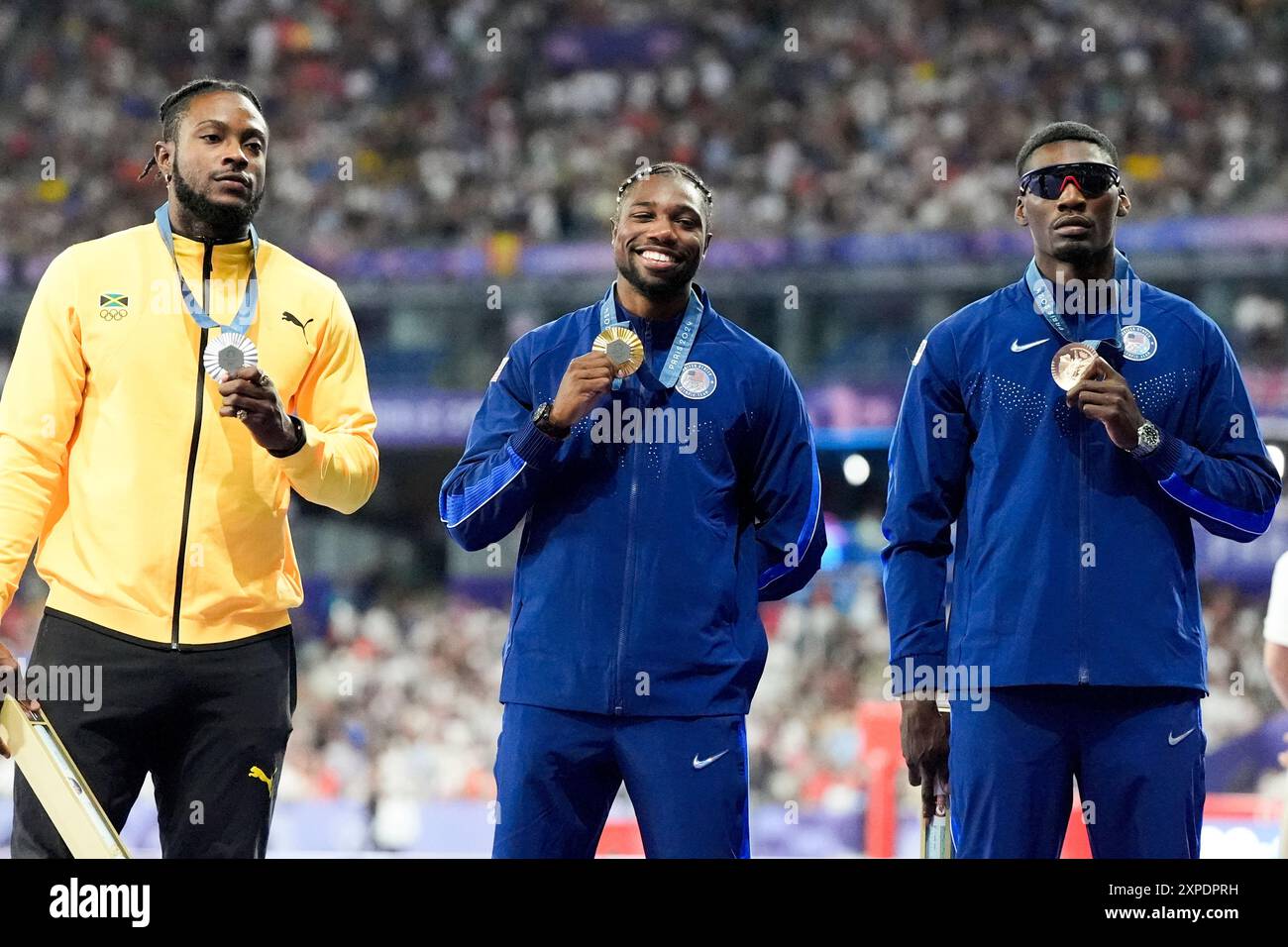 Gold medalist, Noah Lyles, of the United States, stands with silver ...