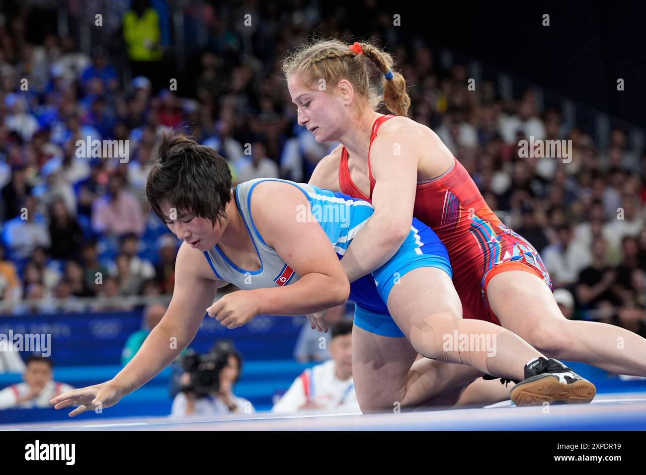 United State's Amit Elor and North Korea's Sol Gum Pak, left, compete ...