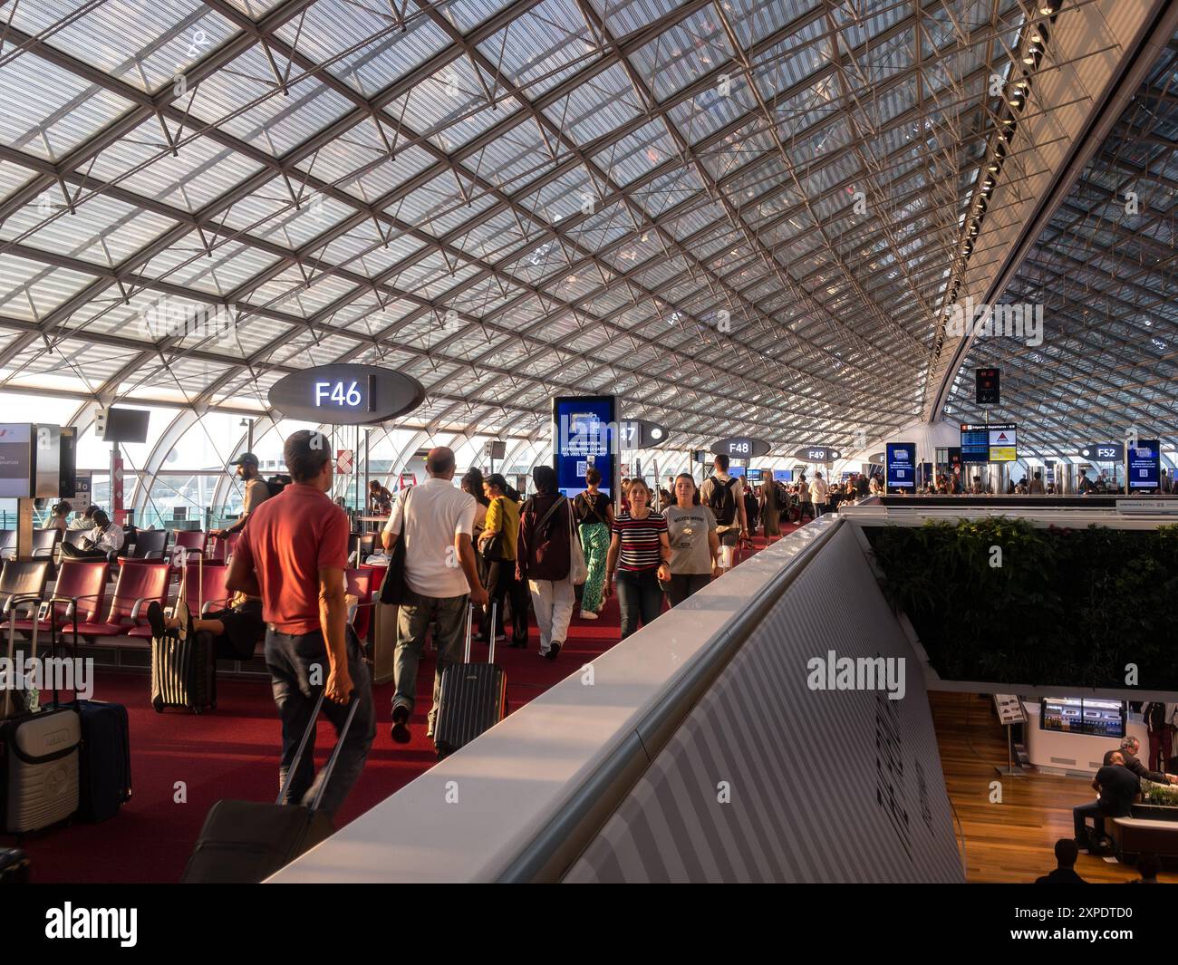 PARIS, FRANCE - SEPTEMBER 8, 2023: Passengers at Charles de Gaulle airport (CDG) wating for ...