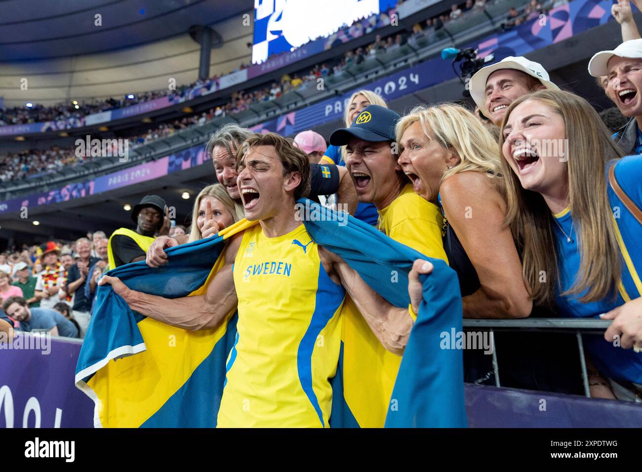Armand Duplantis, of Sweden, celebrates with the crowd after setting a ...