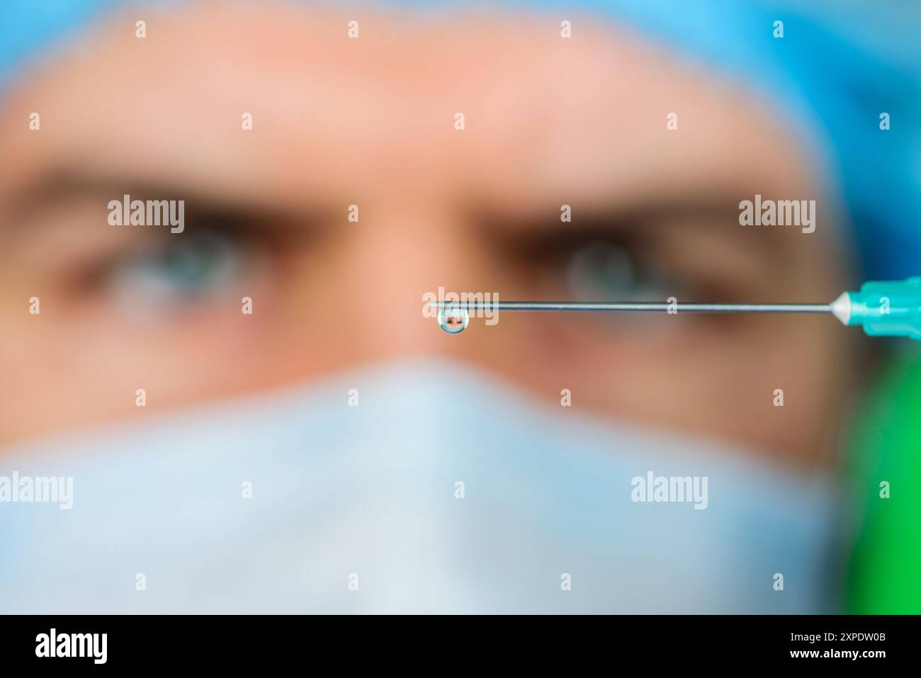 Vaccination and immunization in hospital. Doctor in medical mask with ...