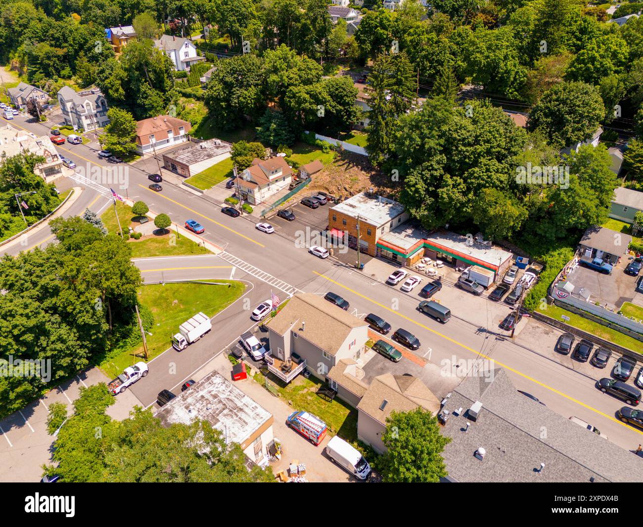 Homes and businesses by the Hawthorne train station New York, USA 2024 ...
