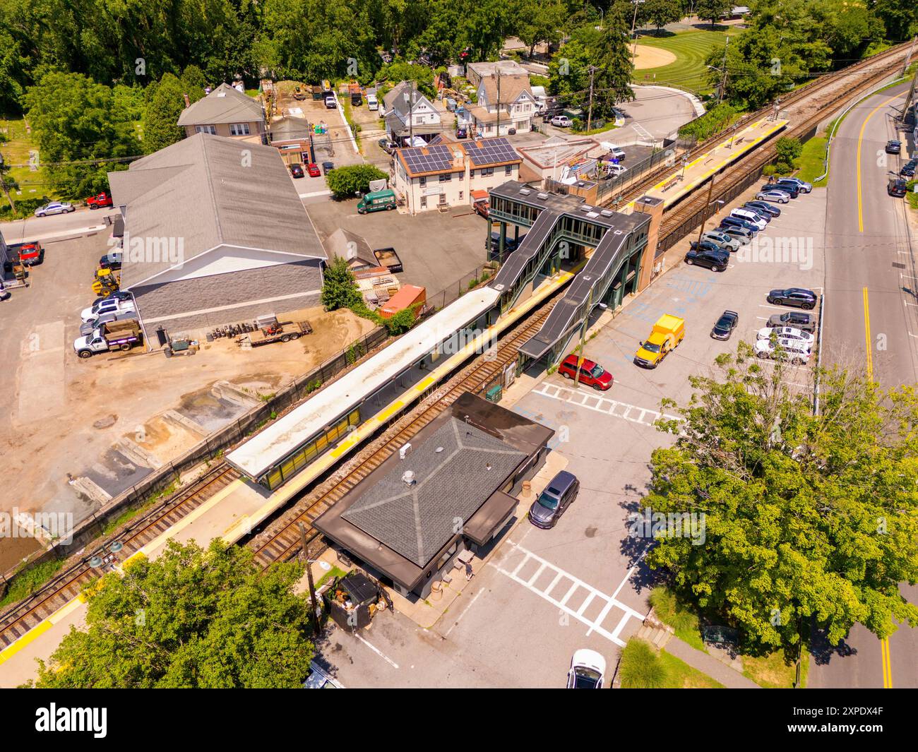 Homes and businesses by the Hawthorne train station New York, USA 2024 ...