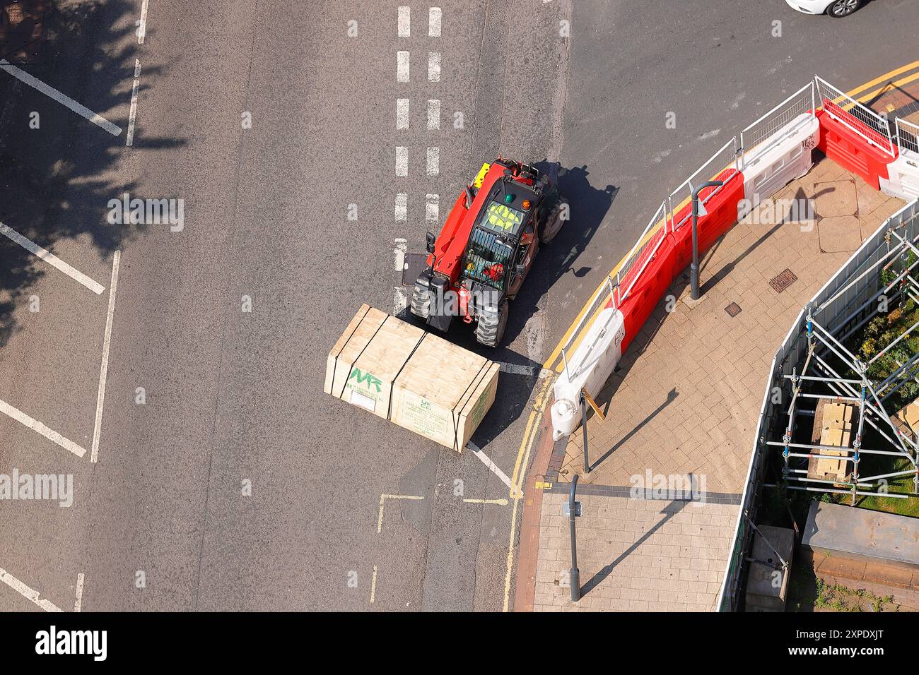 Telescopic handler carrying materials on public roads in Leeds City ...