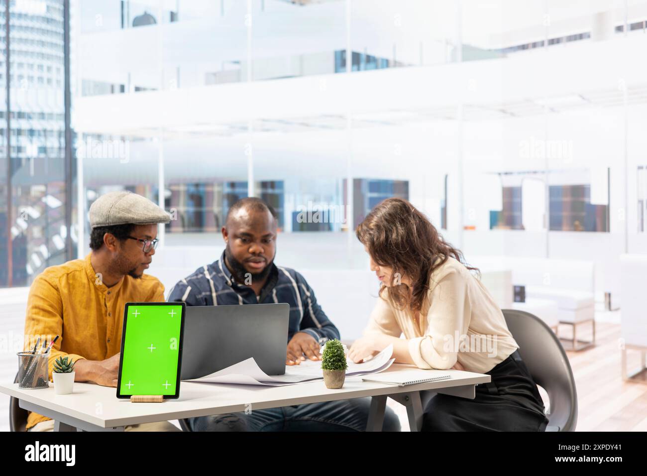 Team business experts reviewing new hi-res stock photography and images ...