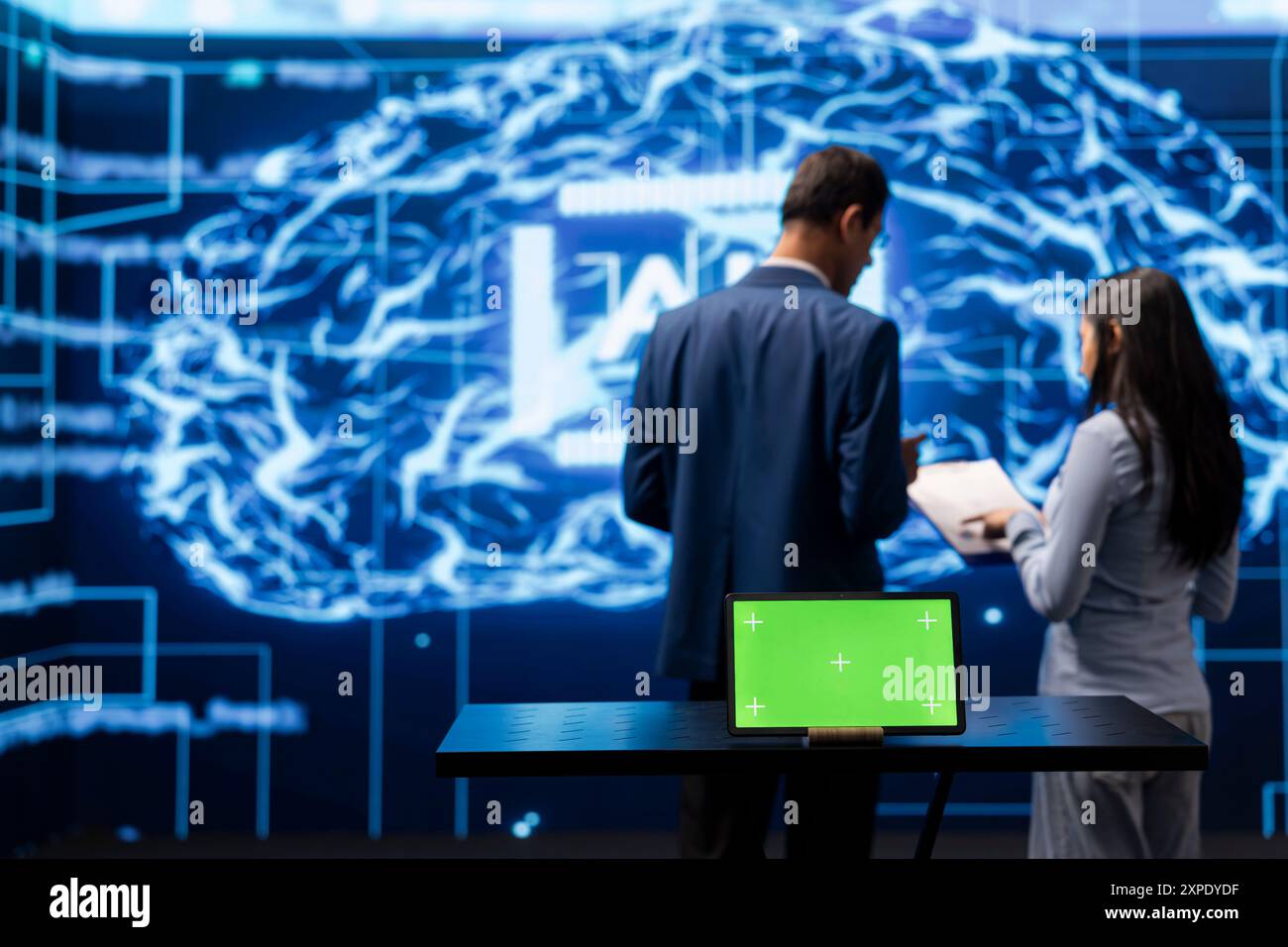 AI developers colleagues using green screen laptop for business data analysis. IT specialists in ...