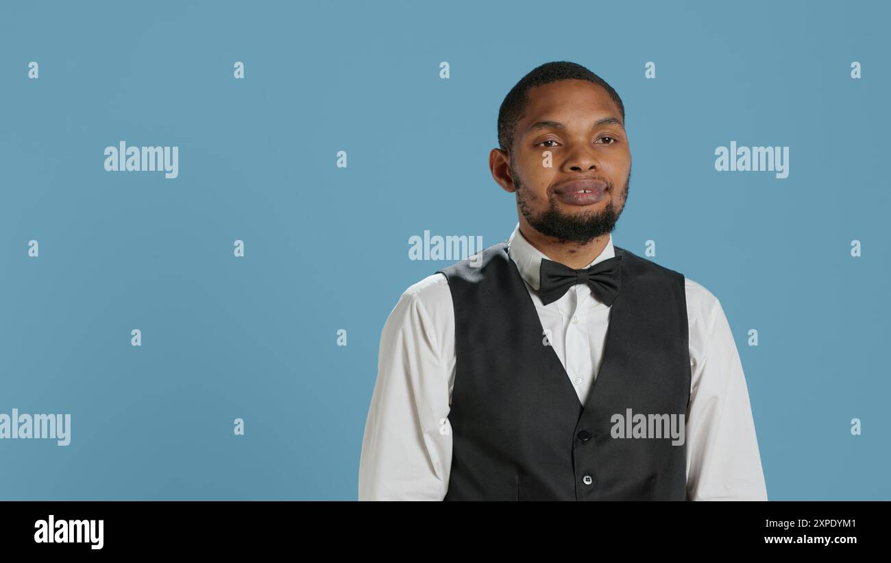 Hotel porter showing the pos terminal with card to symbolize electronic ...