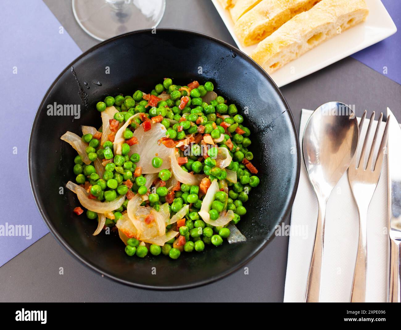 Traditional Spanish side dish peas with jamon Stock Photo - Alamy