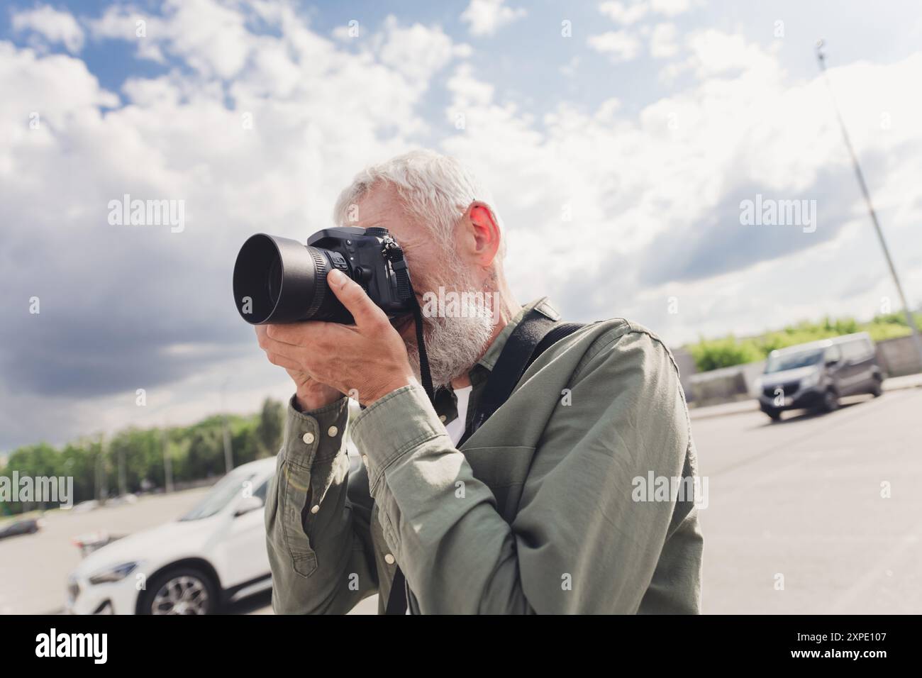 Photo of attractive funny retired guy wear khaki shirt tacking photos ...