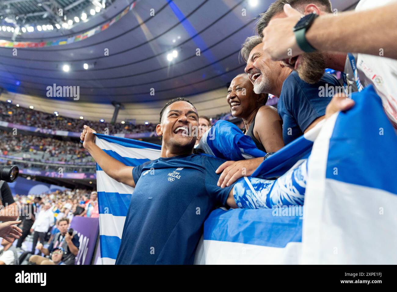 Emmanouil Karalis, of Greece, from left, celebrates with his mother ...