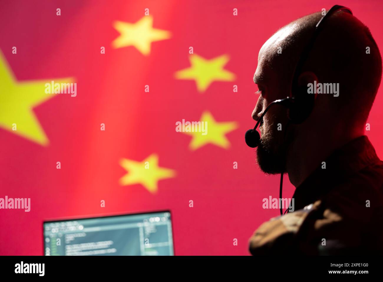 Chinese army communication systems operator using radio and satellite equipment, providing ...