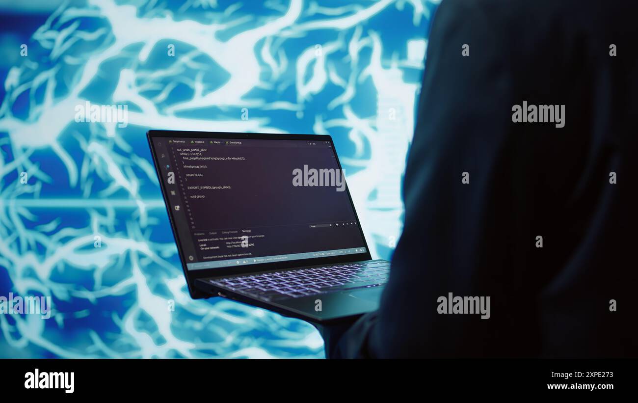 Technician uses laptop and AI neural networks modeled after human brain to solve complex ...