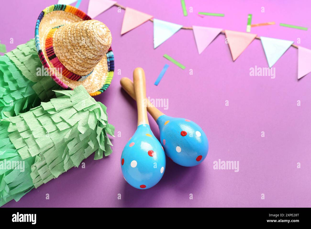 Mexican maracas with pinata, sombrero hat, paper flags and confetti on ...